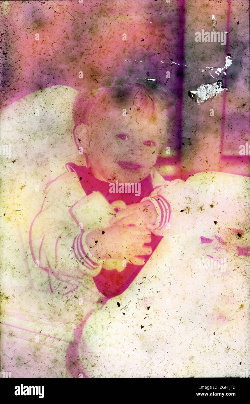 Austin Texas USA, 1997: One-year-old baby boy having breakfast at home ...