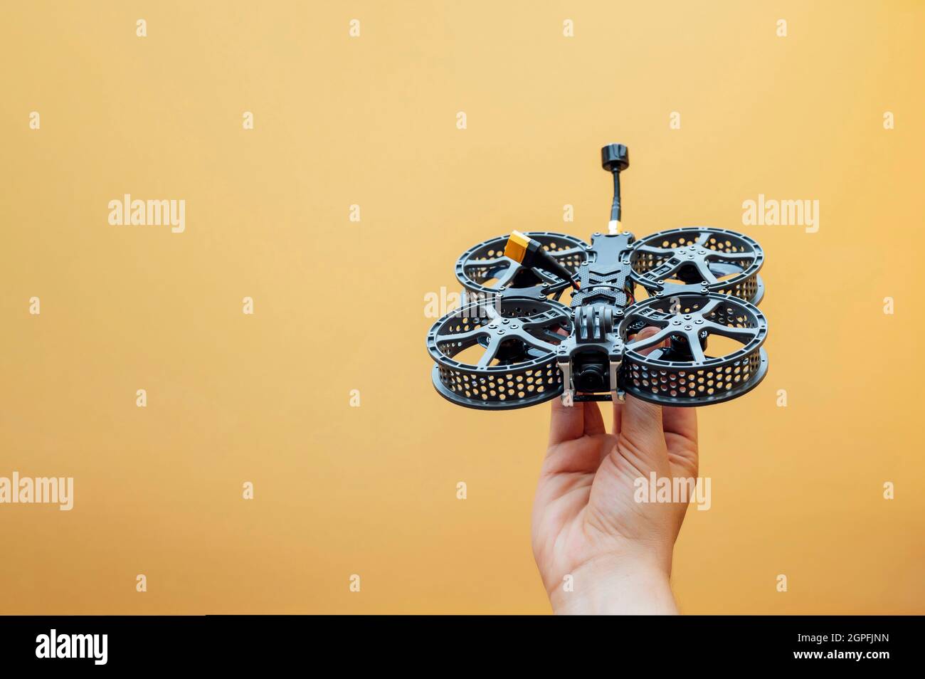 Hand holding a drone Stock Photo - Alamy