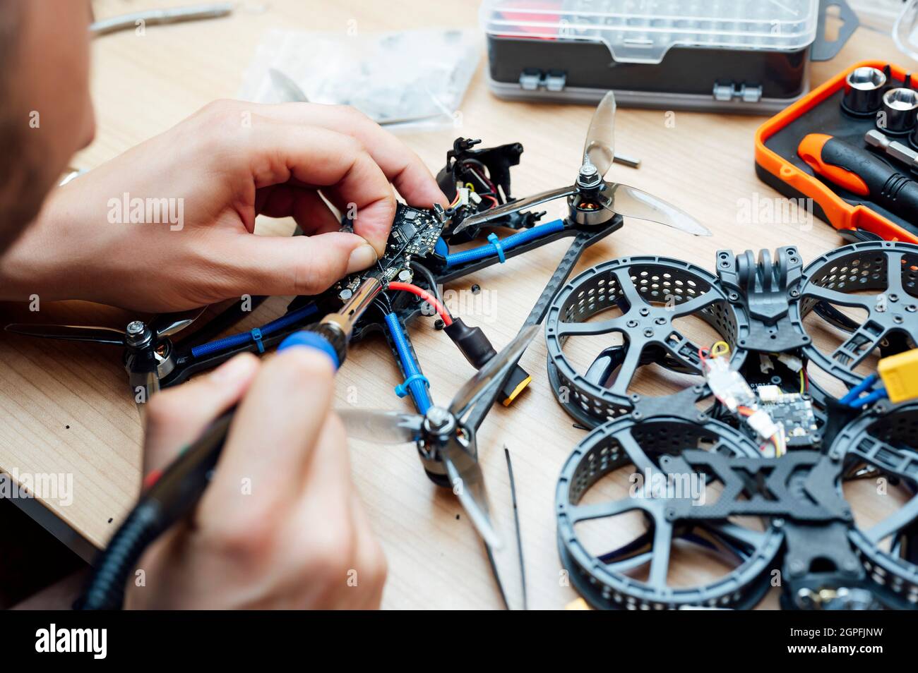Man Repair A Drone.Engineer repairs a drone at home Stock Photo - Alamy