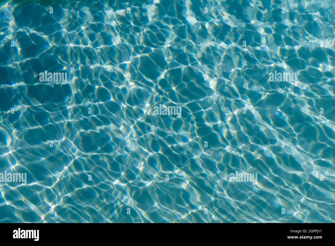 Clear blue ripples on water in a swimming pool or sea Stock Photo - Alamy