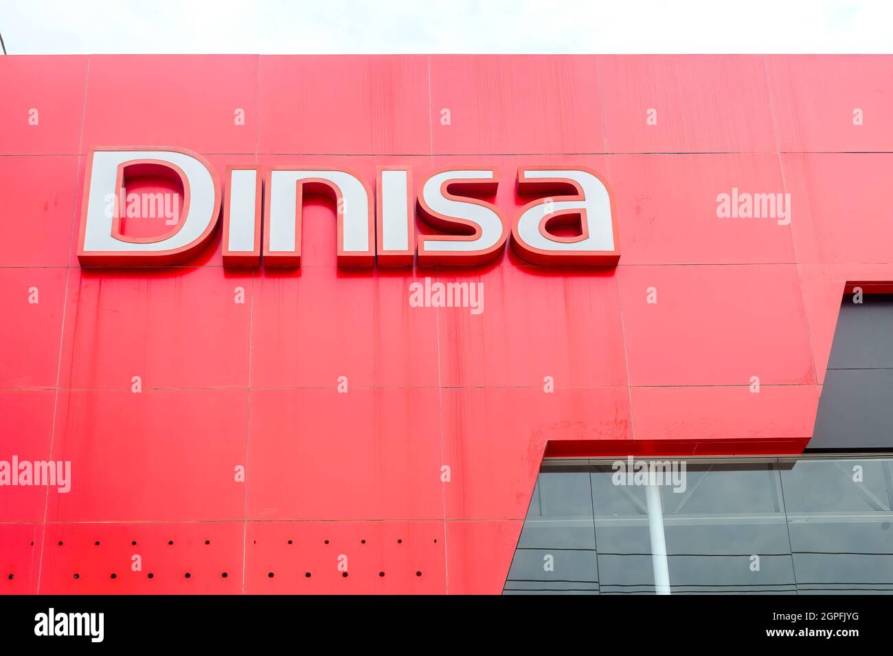 Dinisa sign or logo in a car business dealership exterior wall in ...