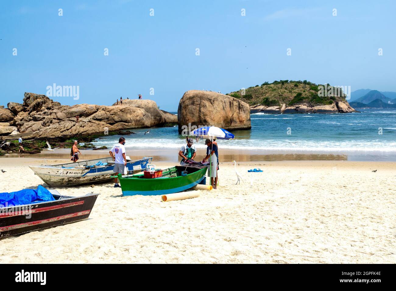 Artisanal fishing boats are seen in the sand of the Piratininga Beach ...