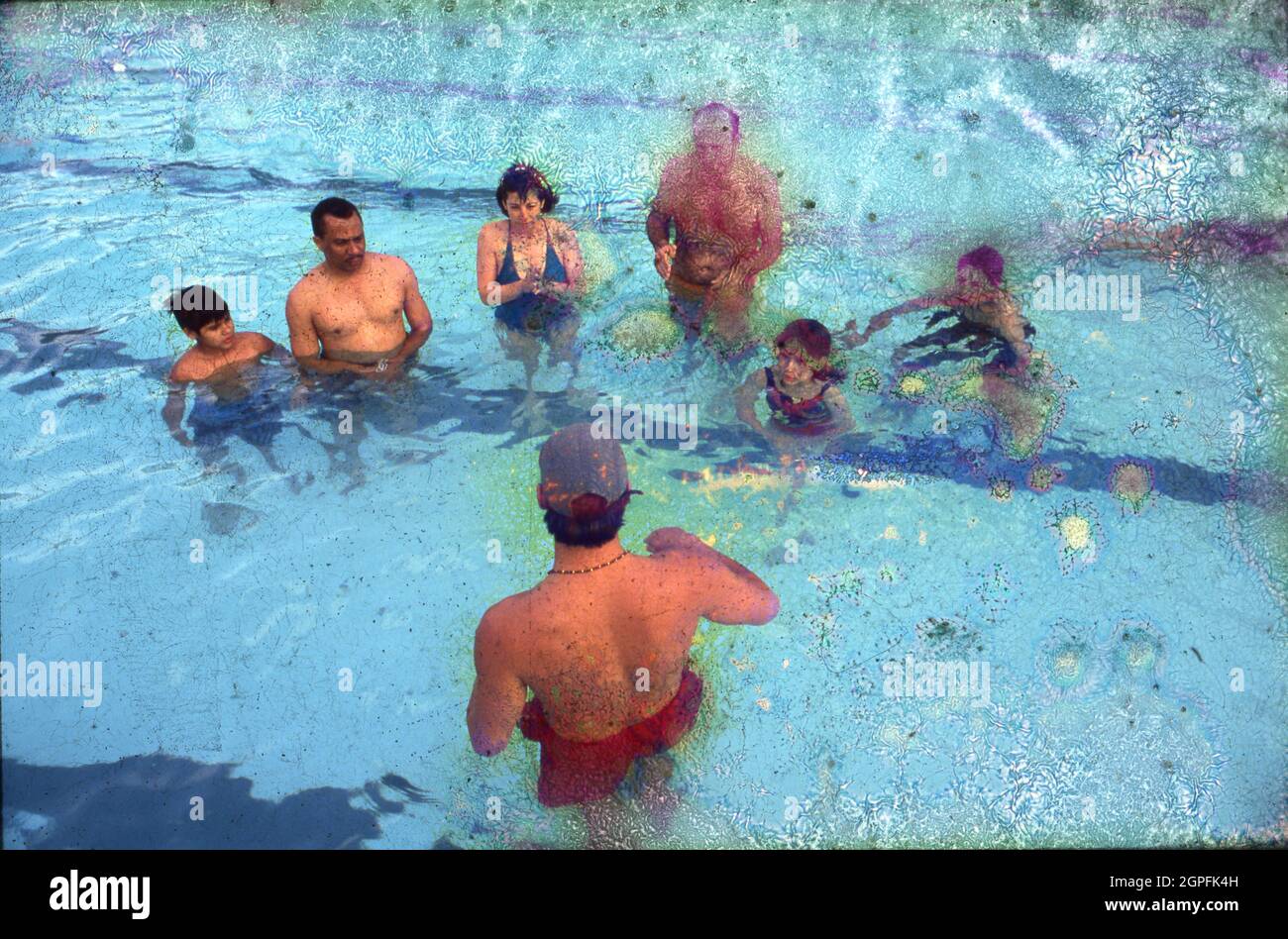 Austin Texas USA, circa 1994: Lifeguard gives swimming lessons to a ...