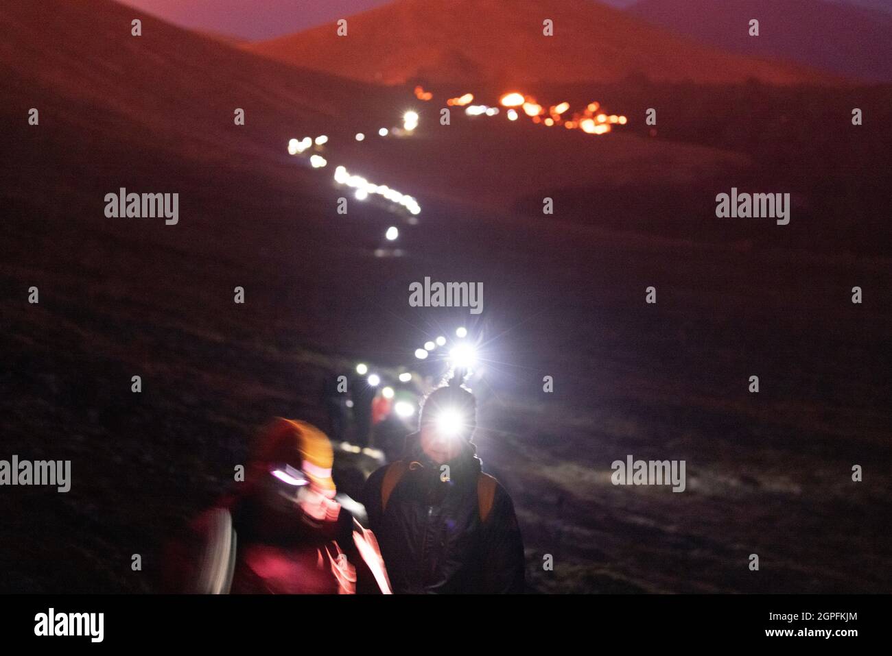 people walking to volcano erupting Stock Photo - Alamy