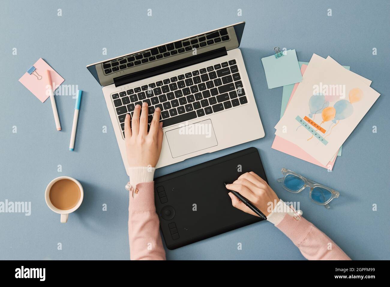 Flat lay, top view of designer working at her desk Stock Photo - Alamy