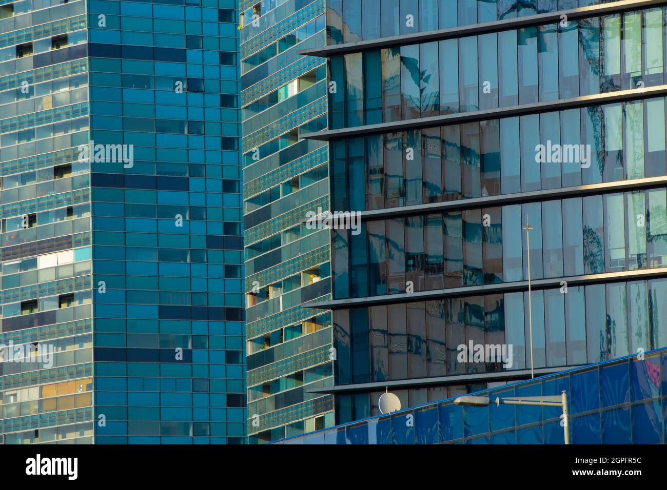 Buildings reflections on office building glass Stock Photo - Alamy