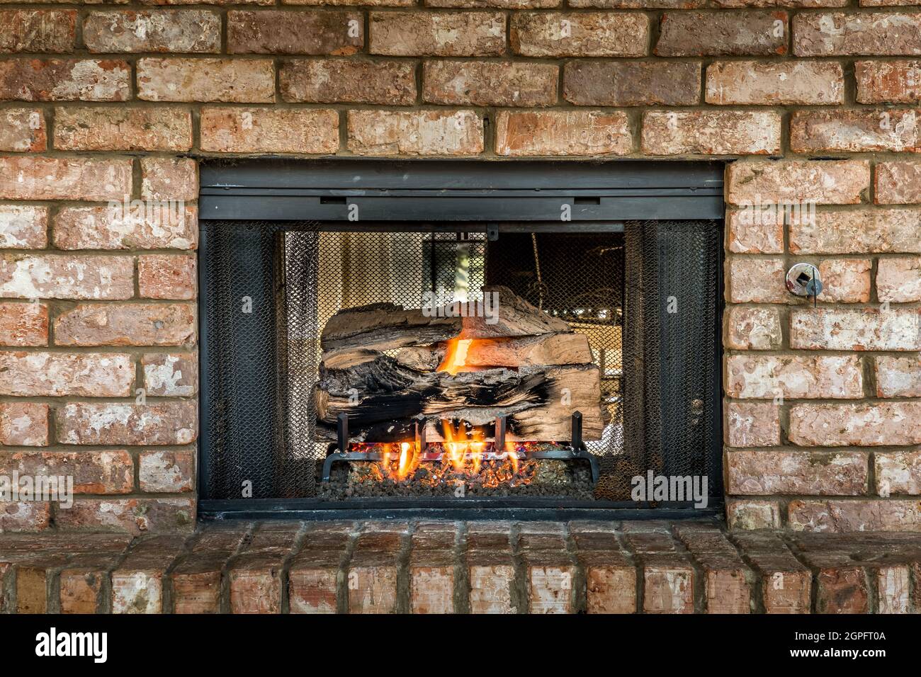 Burning fire place in a Texas home Stock Photo - Alamy