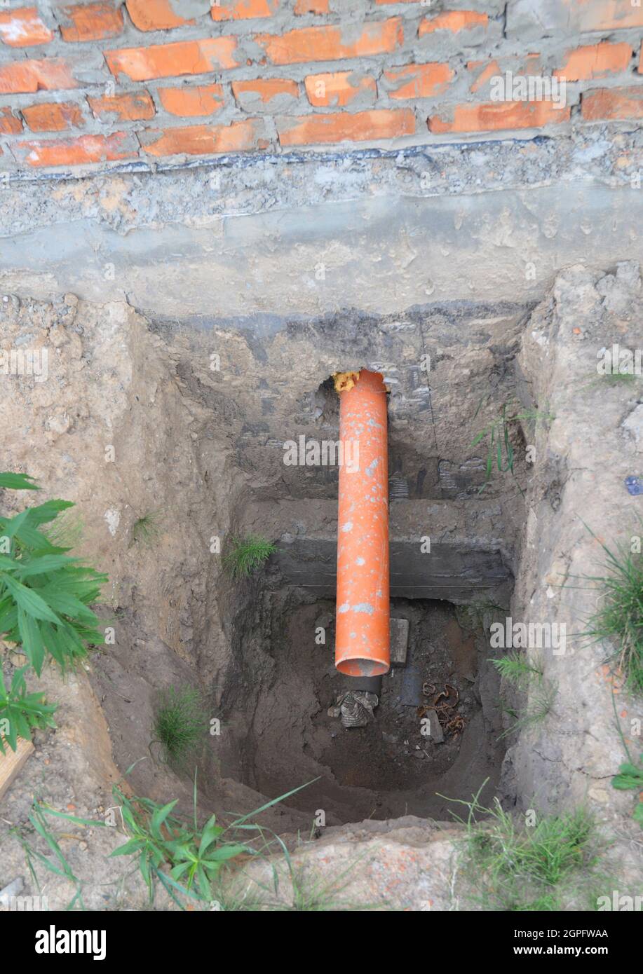 Close up on house septic drainage pipe in home foundation. Drain system ...