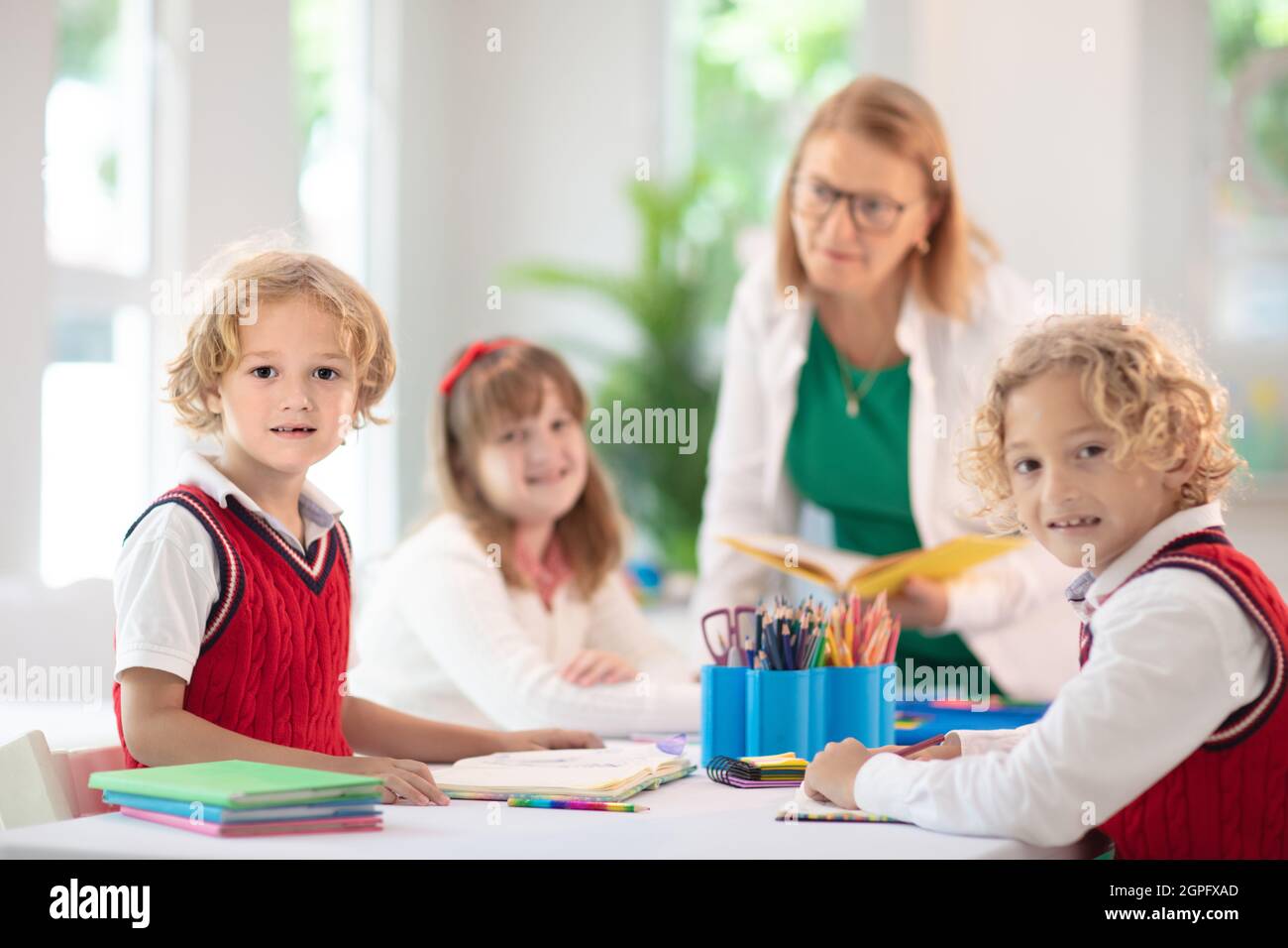 Kids in school. Preschool children in class. Happy kids back to school ...
