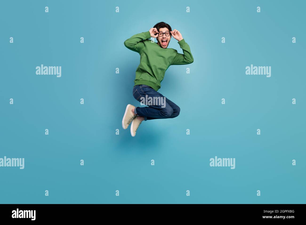 Full size photo of happy good mood guy in glasses jumping excited ...