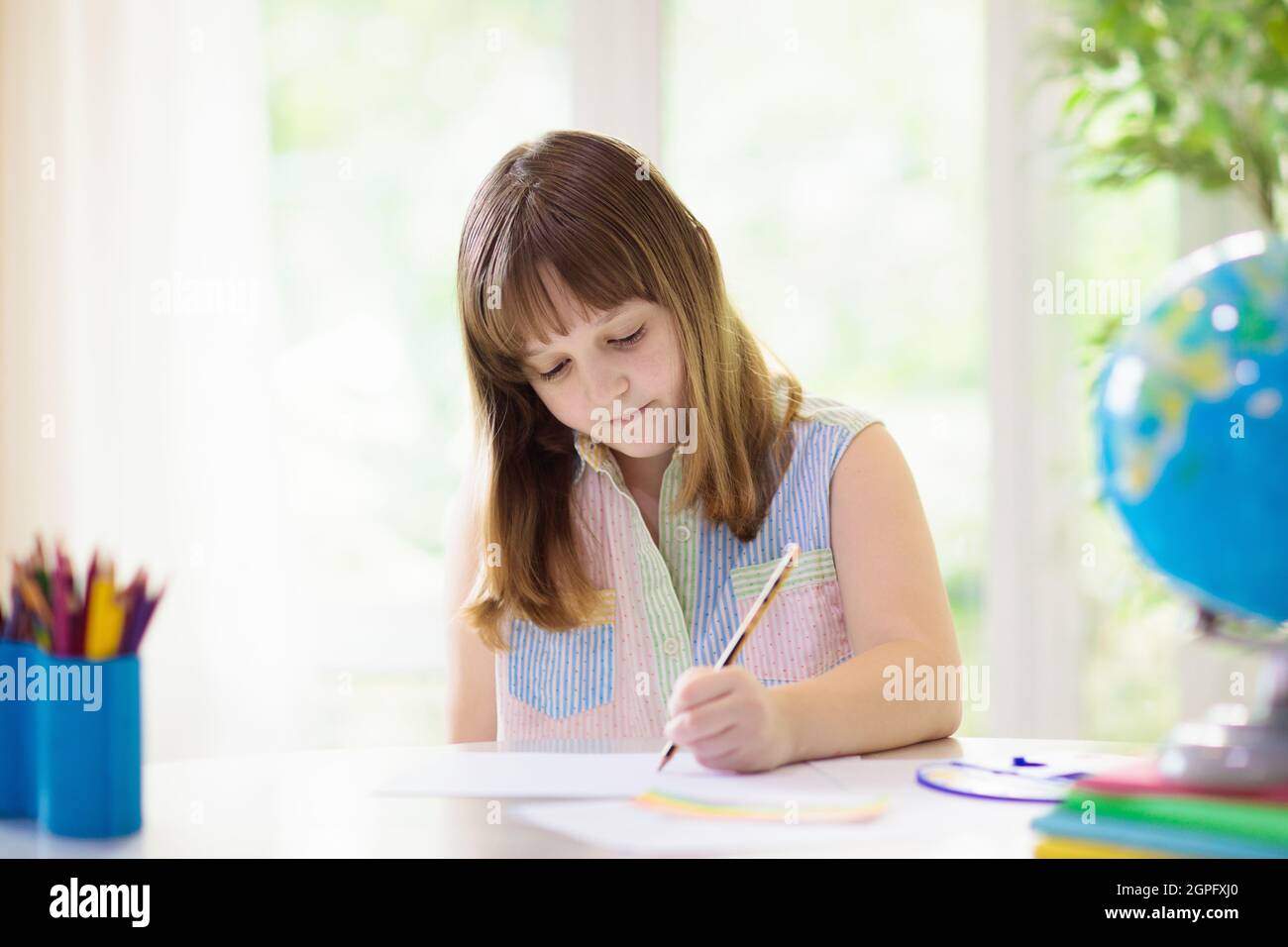 Child drawing rainbow. Paint on hands. Remote learning and online ...