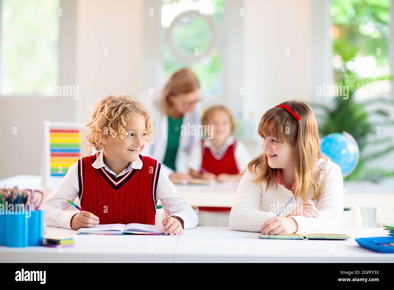 Kids in school. Preschool children in class. Happy kids back to school ...