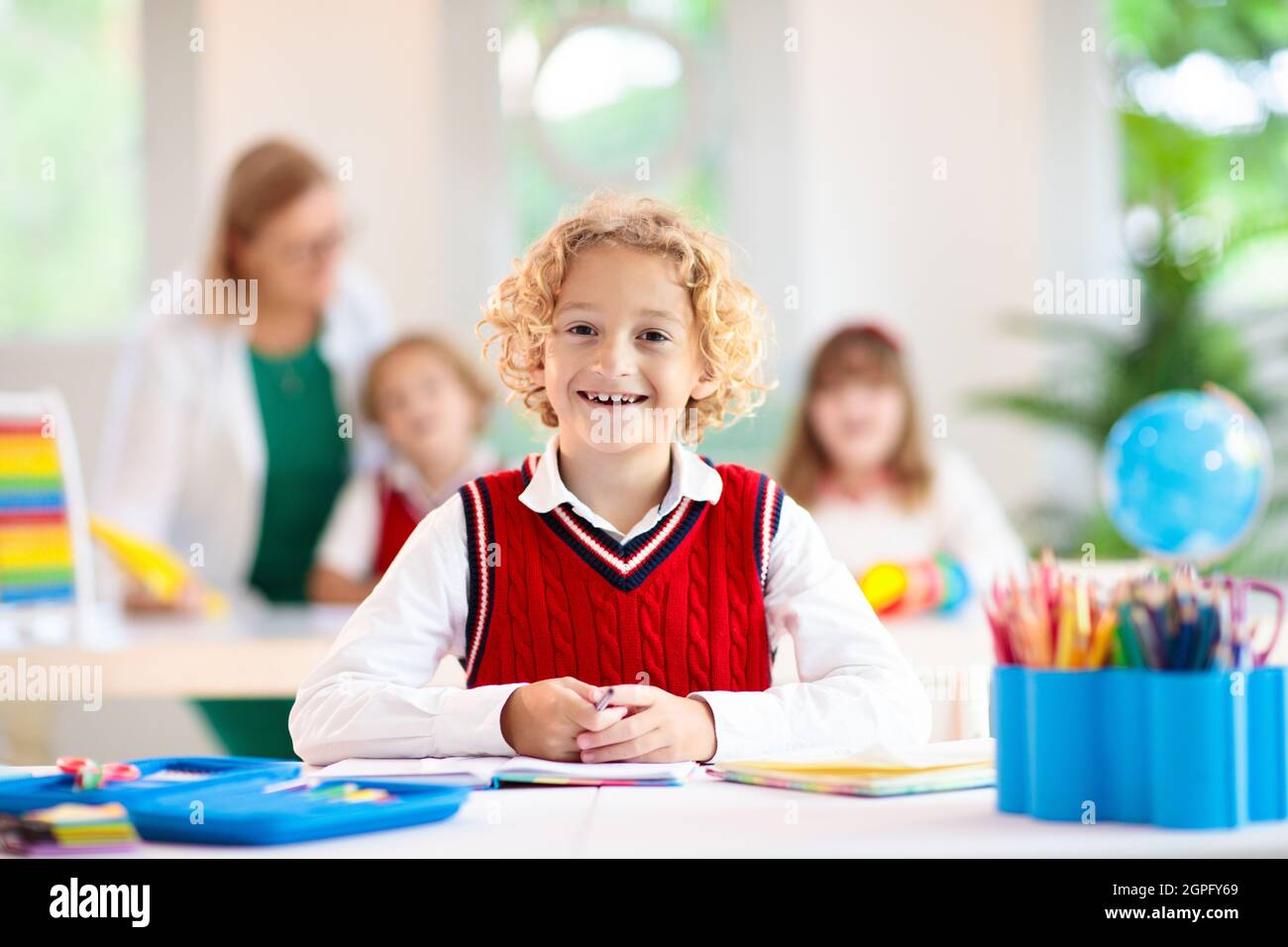 Kids in school. Preschool children in class. Happy kids back to school ...