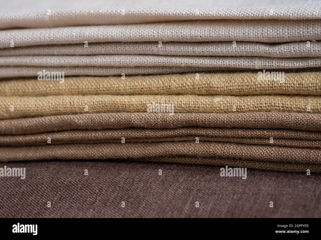 Stack of brown linen fabrics, close up. Macro with shallow dof Stock ...