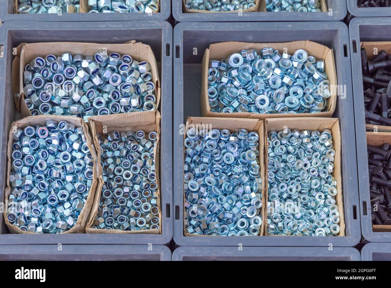 Metal Nuts in Boxes Hardware Store Supply Stock Photo - Alamy
