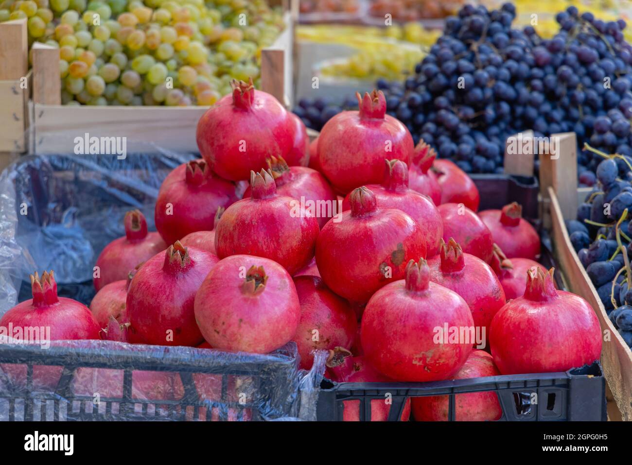 Red Pomegranate Fruits at Farmers Market Stall Stock Photo - Alamy