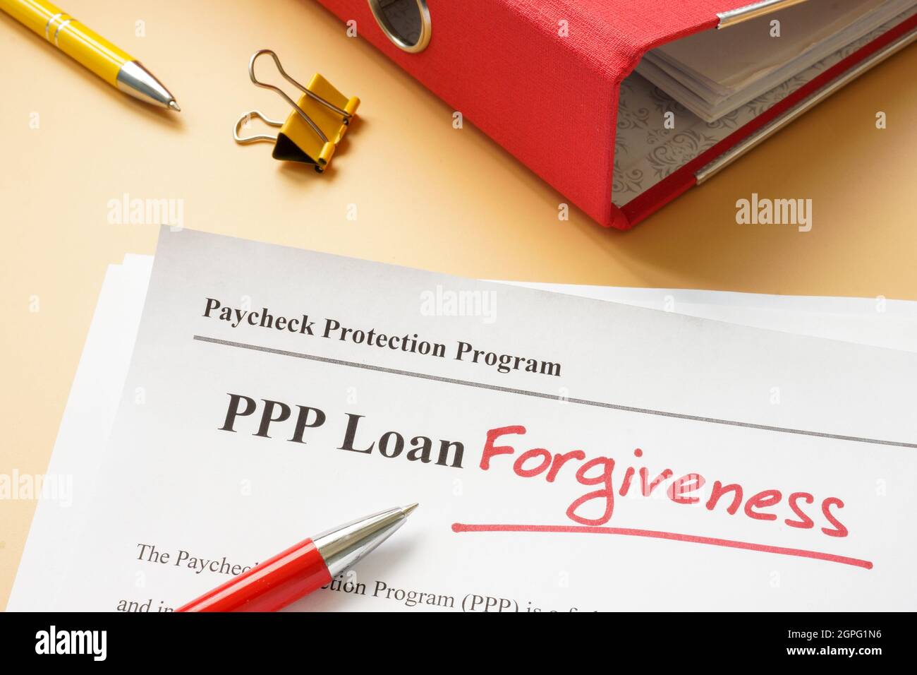 PPP loan forgiveness handwritten word on the application Stock Photo ...