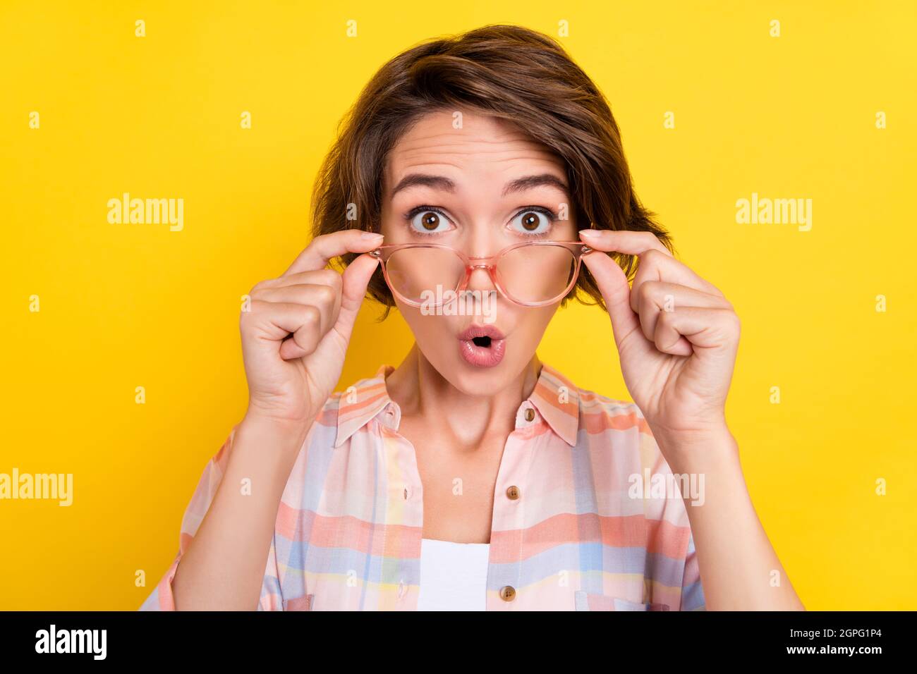 Photo of amazed shocked young woman reaction information wear glasses ...