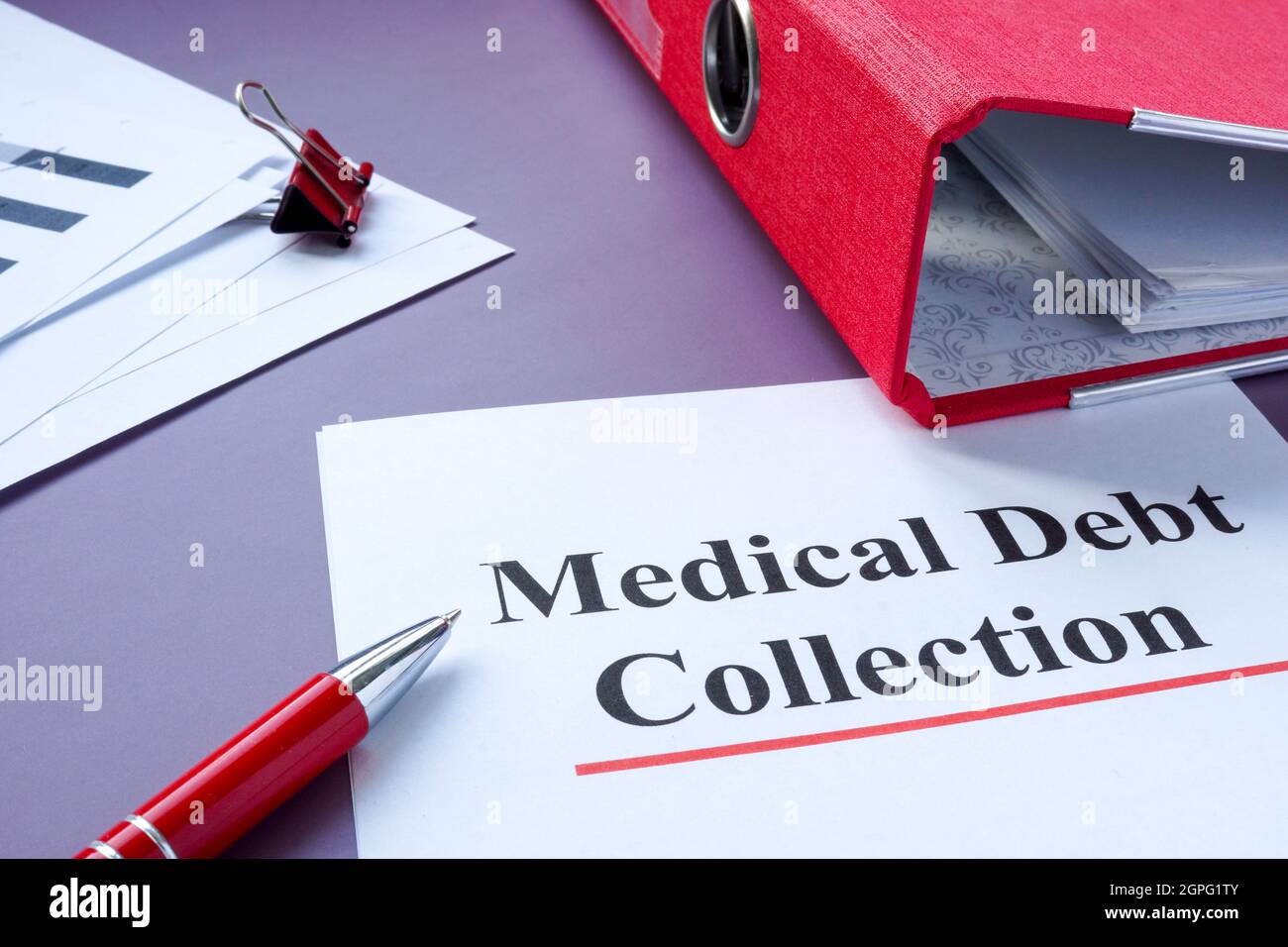 Medical debt collection papers and red folder Stock Photo - Alamy