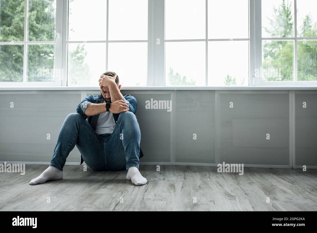 Very sad upset person suffering from grief, loneliness and depression ...