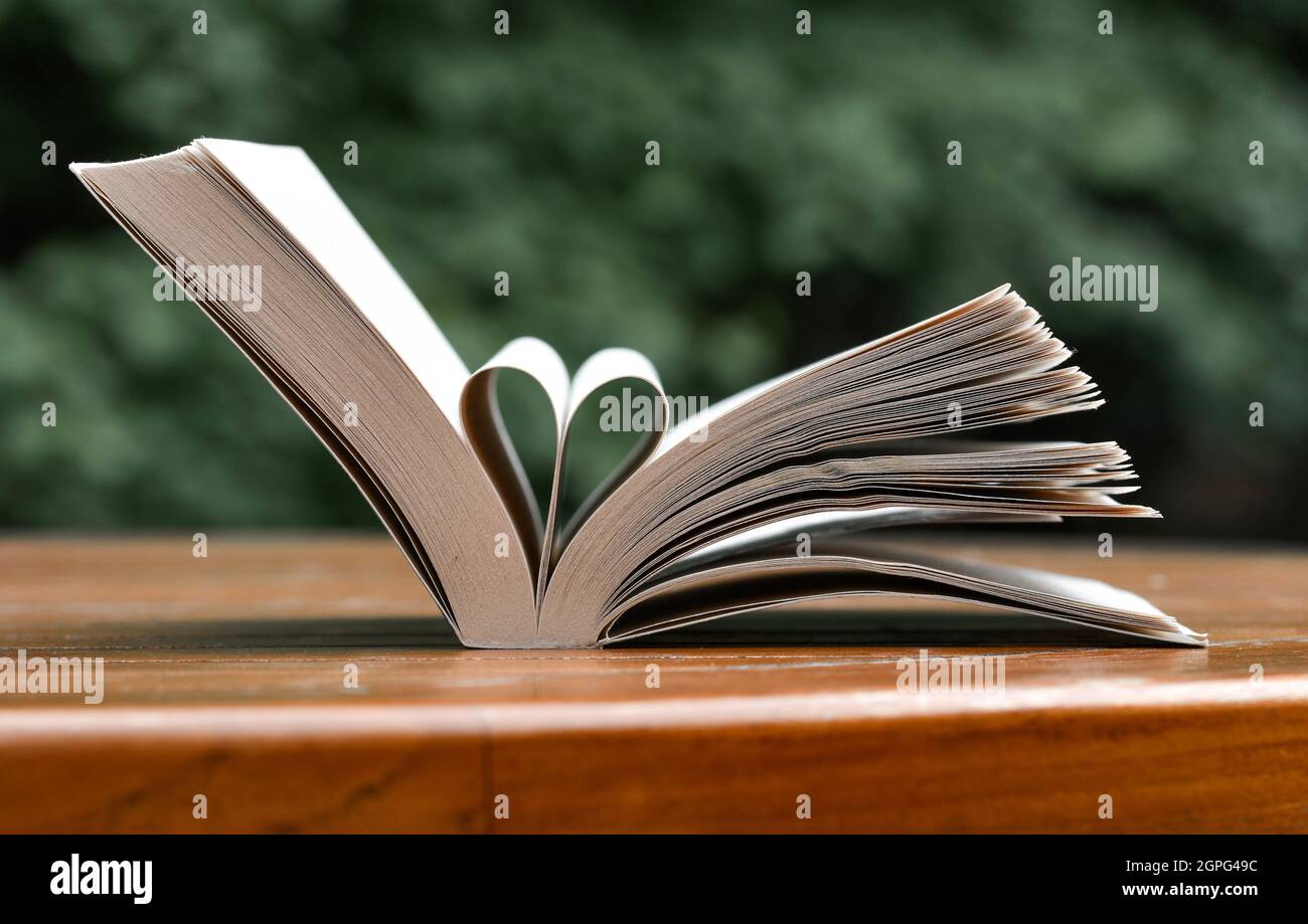 Photo of a book with pages formed as a heart shape Stock Photo - Alamy