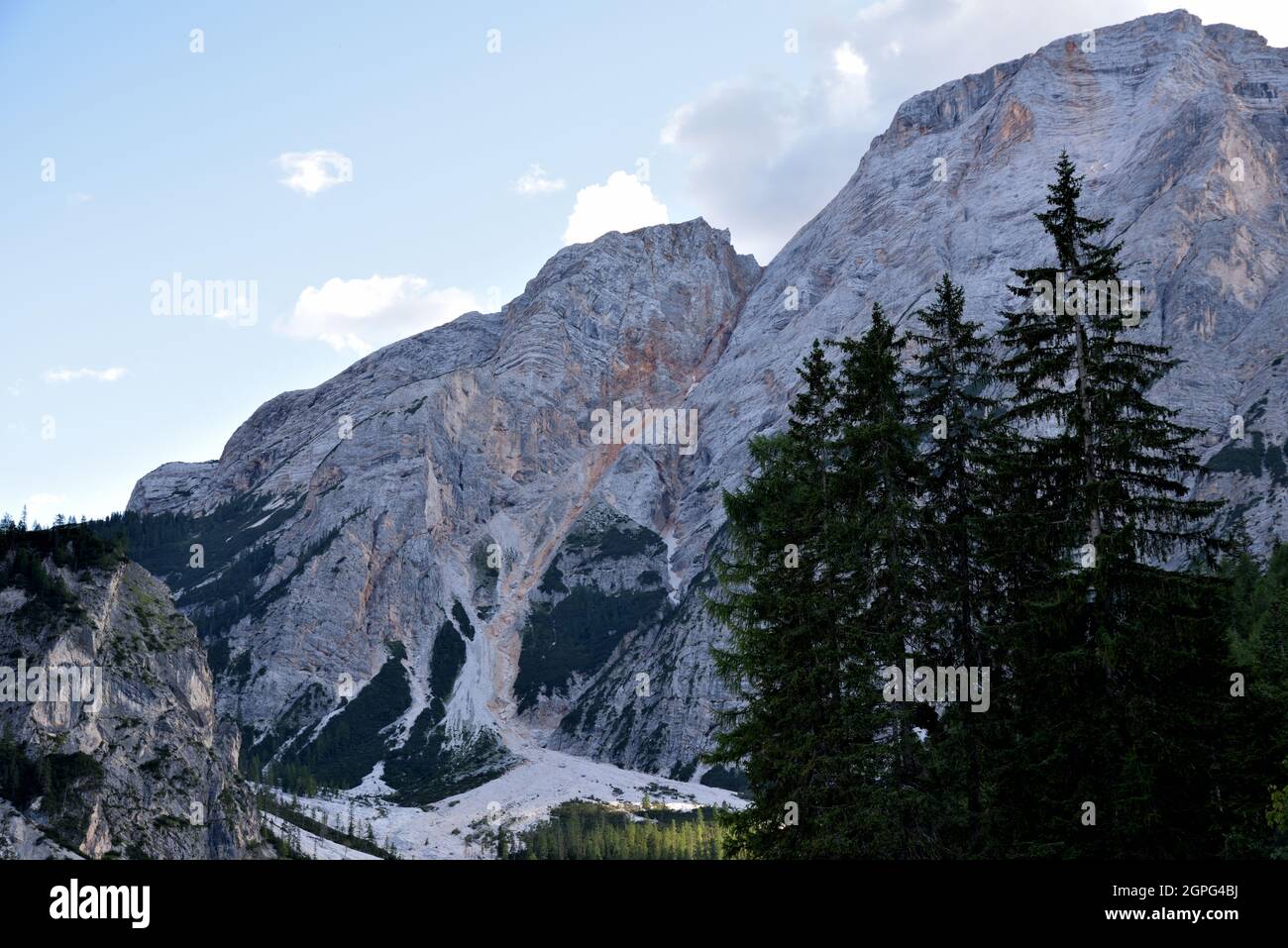 The rocks of the Croda del Becco descend almost to touch the water in ...