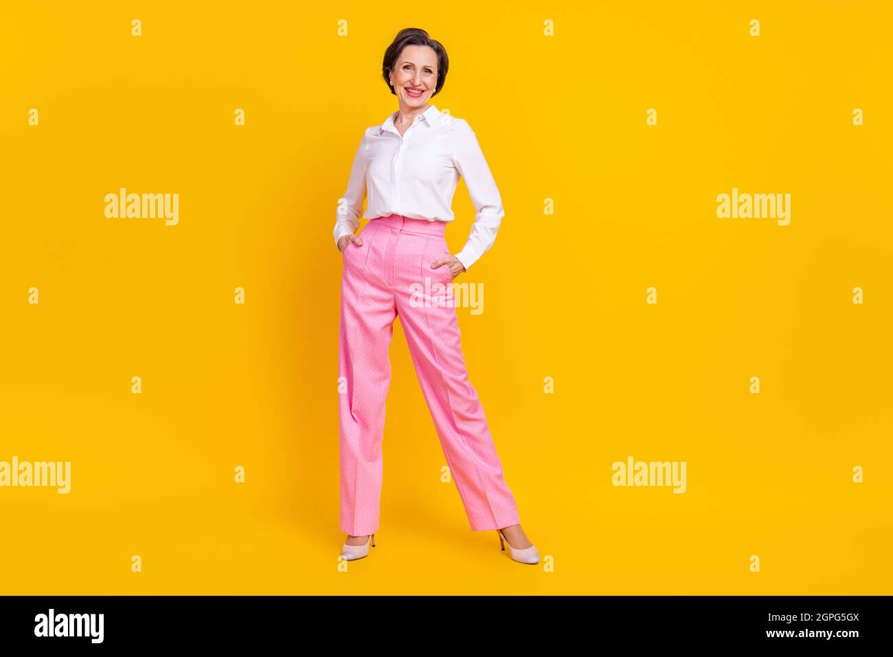 Photo of sweet confident mature lady wear white clothes smiling ...