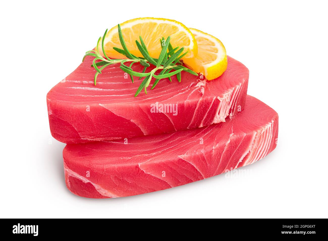 Fresh tuna fish fillet steak with rosemary and lemon isolated on white ...