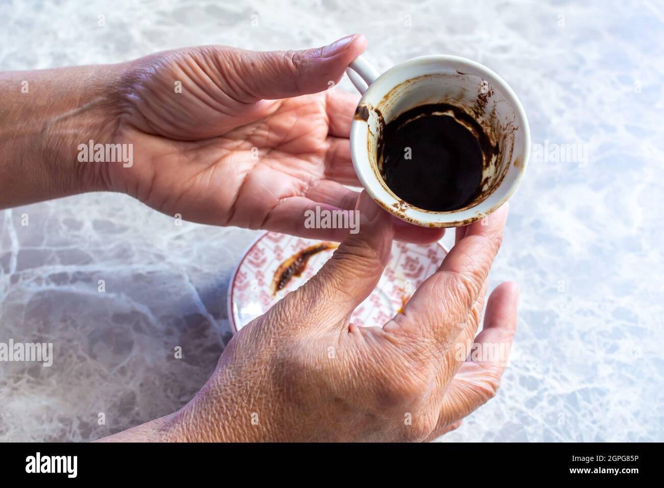 Fortune telling. Woman holding Turkish coffee and fortune telling Stock ...