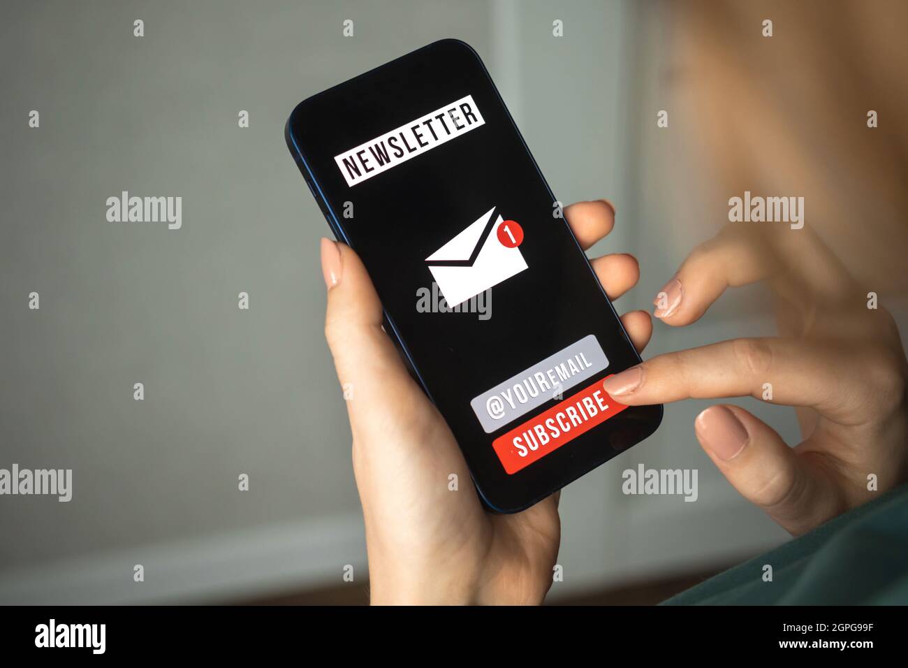 Woman subscribe to newsletter on the mobile phone screen. Customer ...