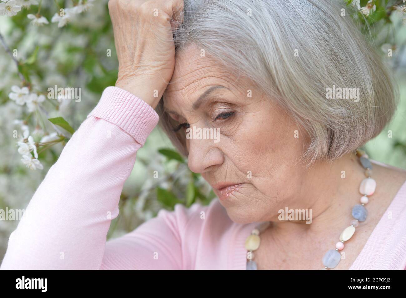 Close up portrait of senior sad woman Stock Photo - Alamy