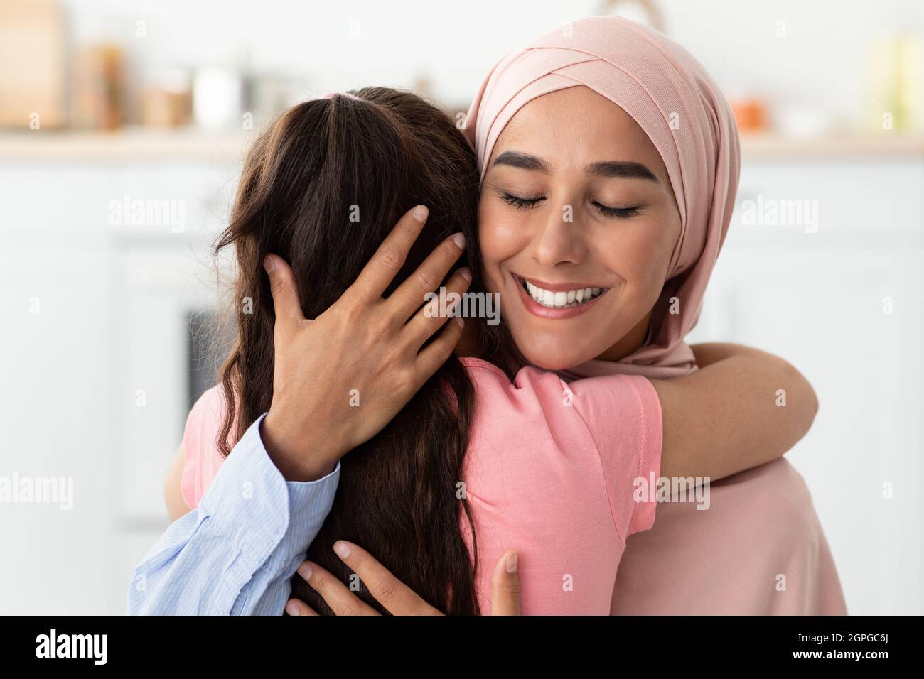 Mother's Love. Beautiful Muslim Woman In Hijab Hugging Her Little ...