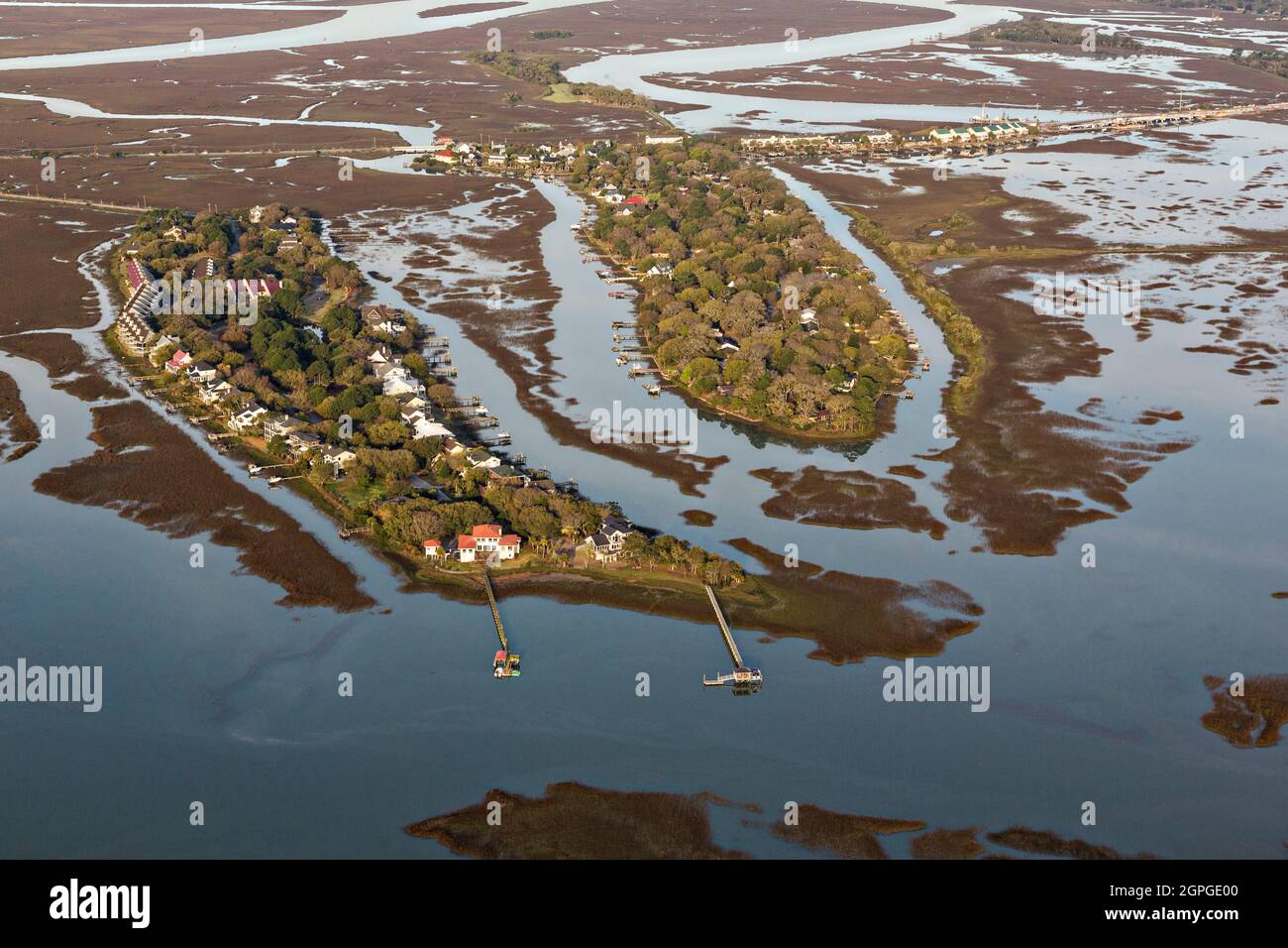 Aerial view of homes surrounded by salt marsh on Oak Island off Folly ...