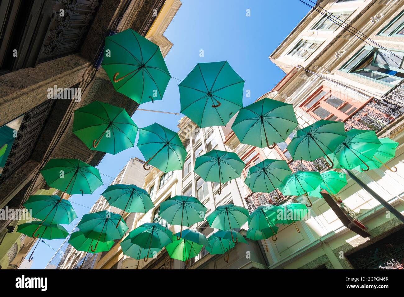 Decorative Green Umbrellas Hanging Between Buildings in the City Stock ...