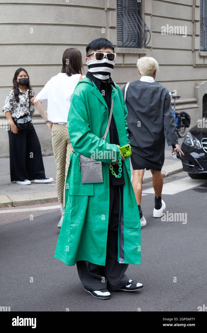 MILAN, ITALY - SEPTEMBER 25, 2021: Declan Chan with long, green coat ...