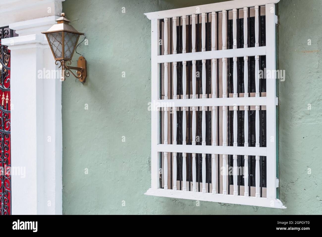 Exterior of a colonial house with a wooden window Stock Photo - Alamy