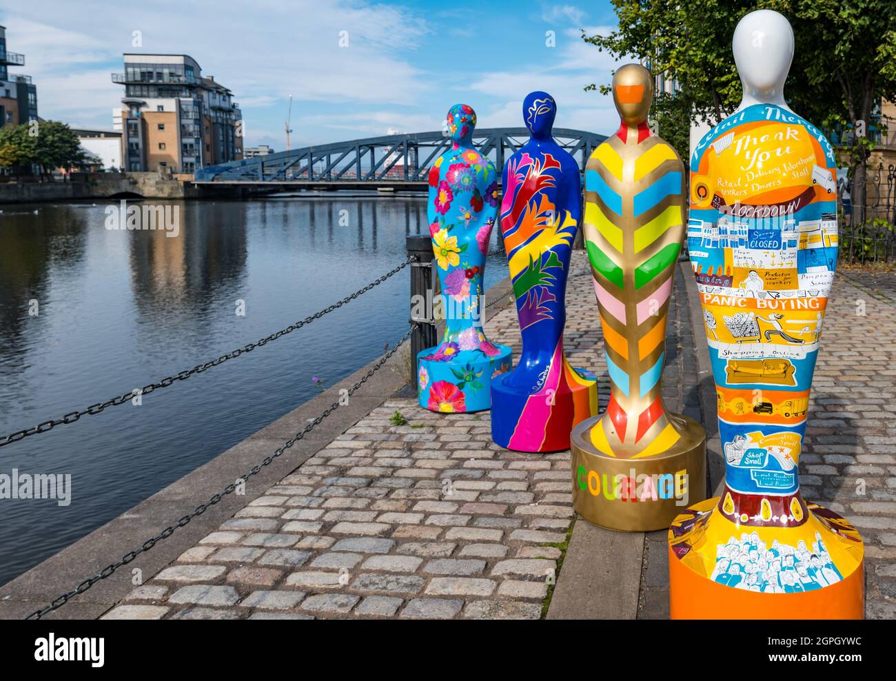 Colourful painted human figure sculptures from Gratitude exhibition ...