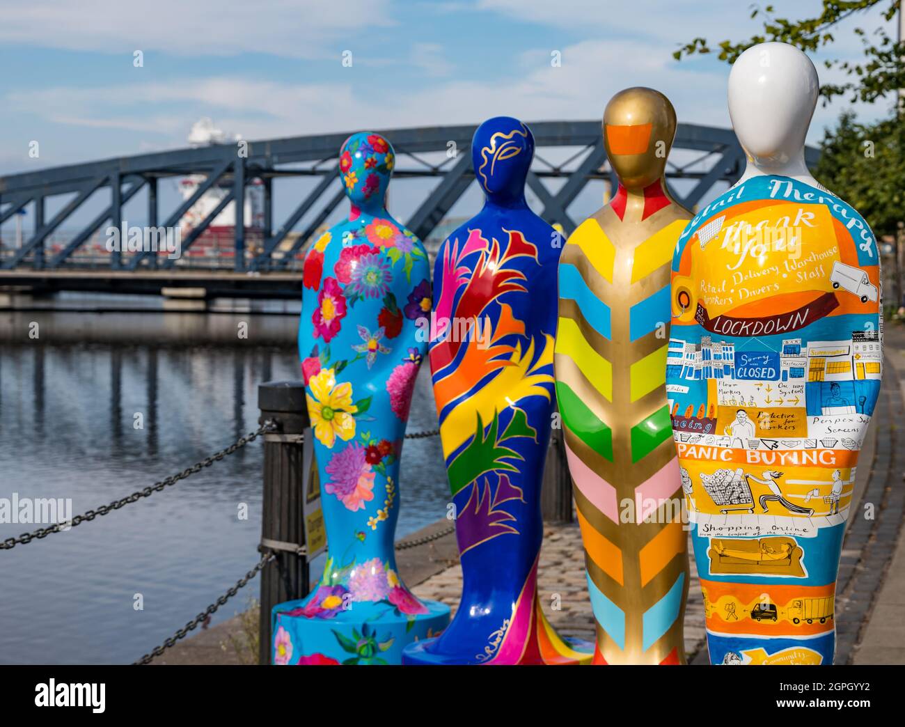 Colourful painted human figure sculptures from Gratitude exhibition ...
