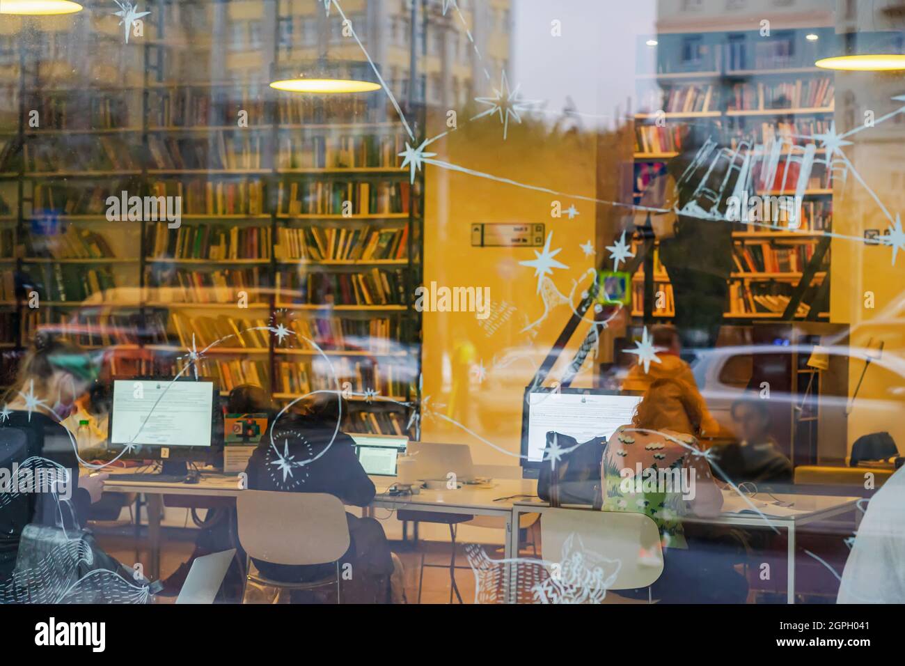 Abstract blurred background of bookshelfs of public library with rows ...