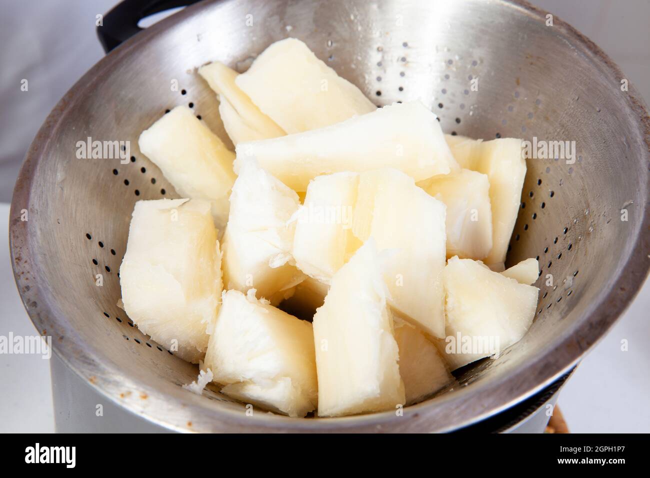 Preparation of a traditional Colombian fried stuffed yucca dumplings ...