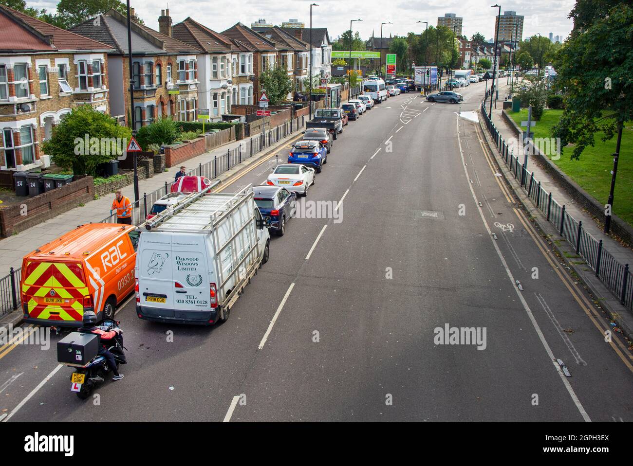 Queues of traffic block the road in both directions as drivers wait ...