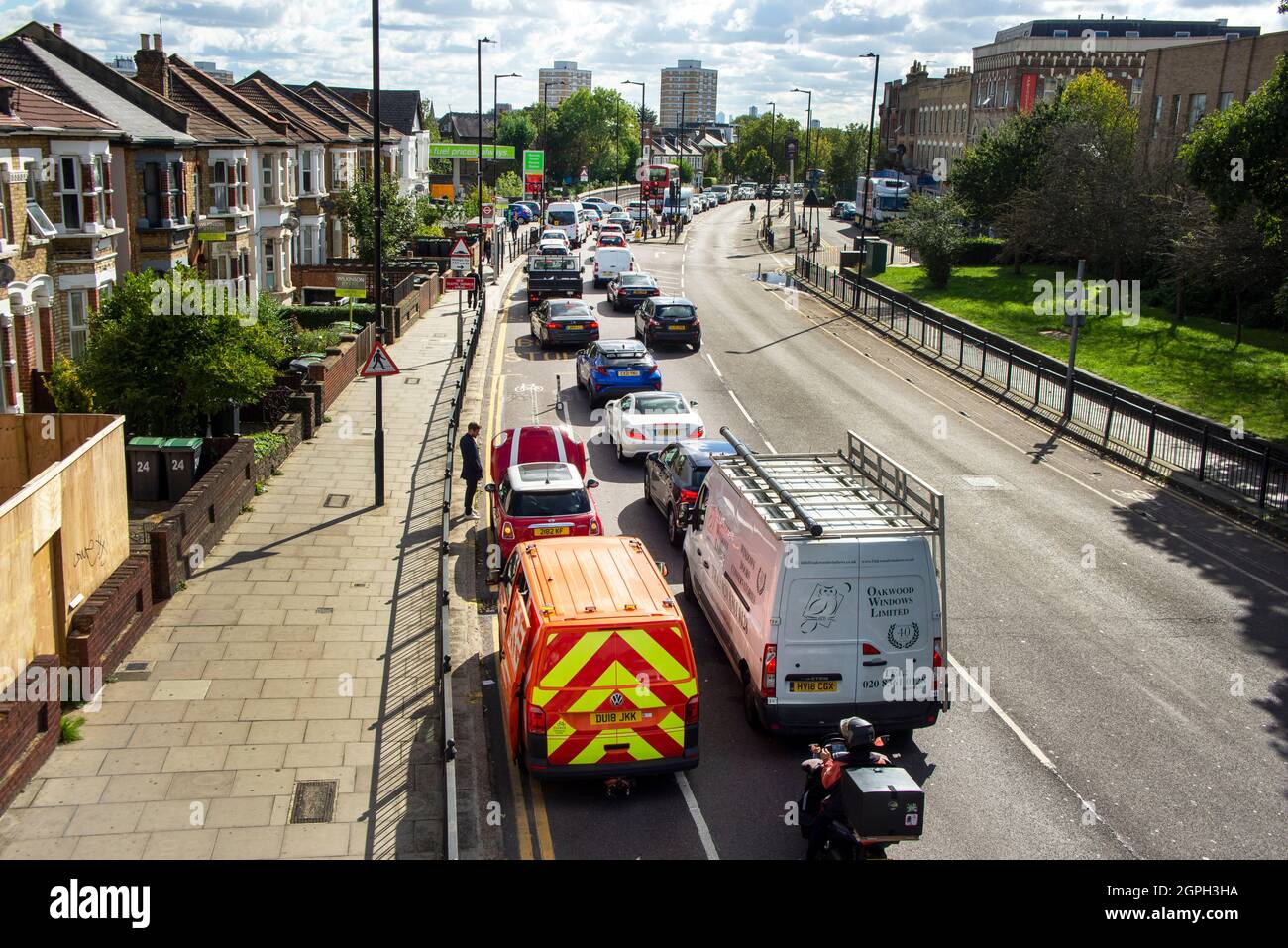 Queues of traffic block the road in both directions as drivers wait ...