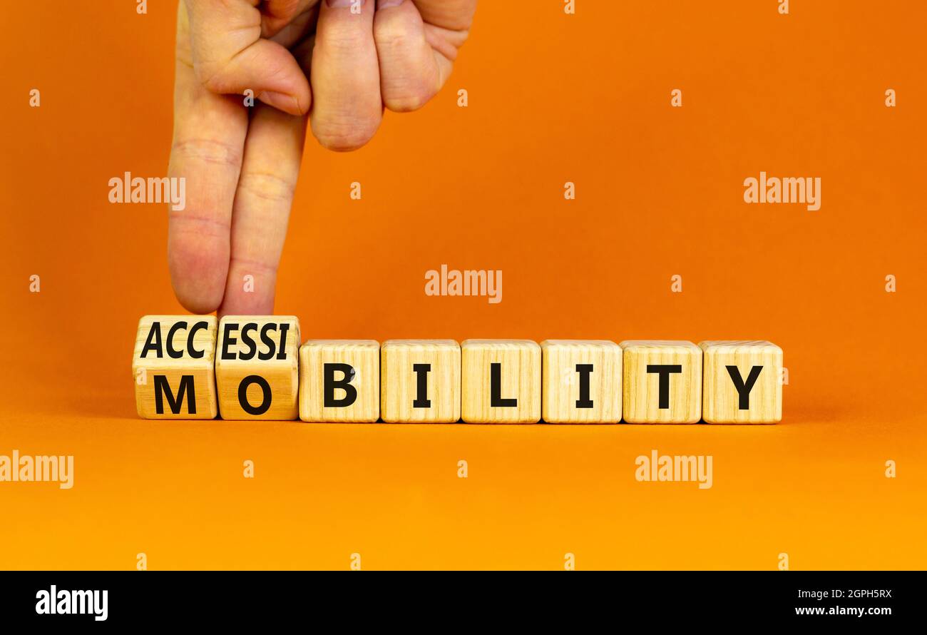 Mobility and accessibility symbol. Businessman turns wooden cubes and ...