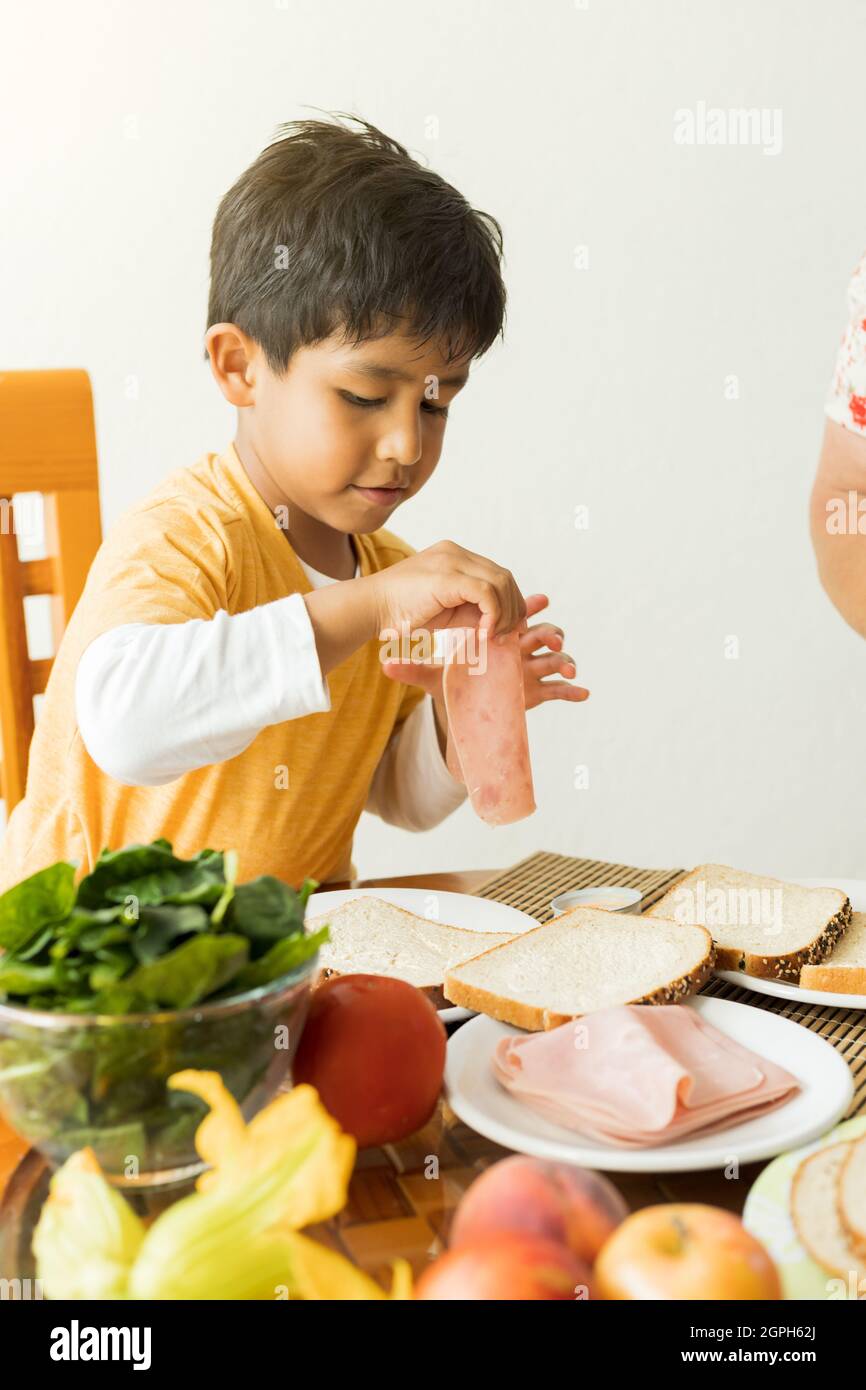 Boy snack ham hi-res stock photography and images - Alamy