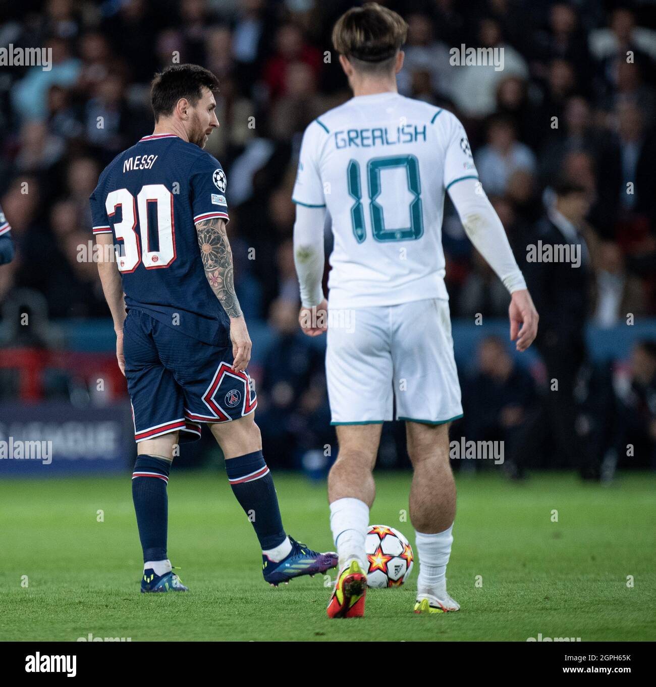 Lionel Messi of Paris Saint-Germain and Jack Grealish during the UEFA ...