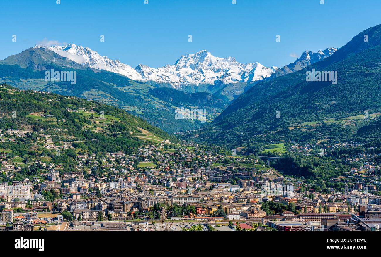 Panoramic view of Aosta with the Grand Combin mountain in the ...