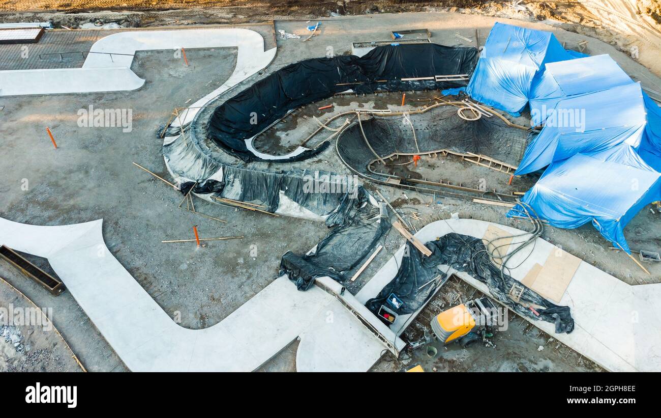 construction machinery on the sports field. construction of athletic ...