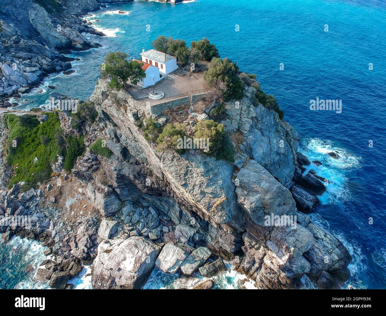 Aerial view of the famous small church Agios Ioannis in Skopelos where ...