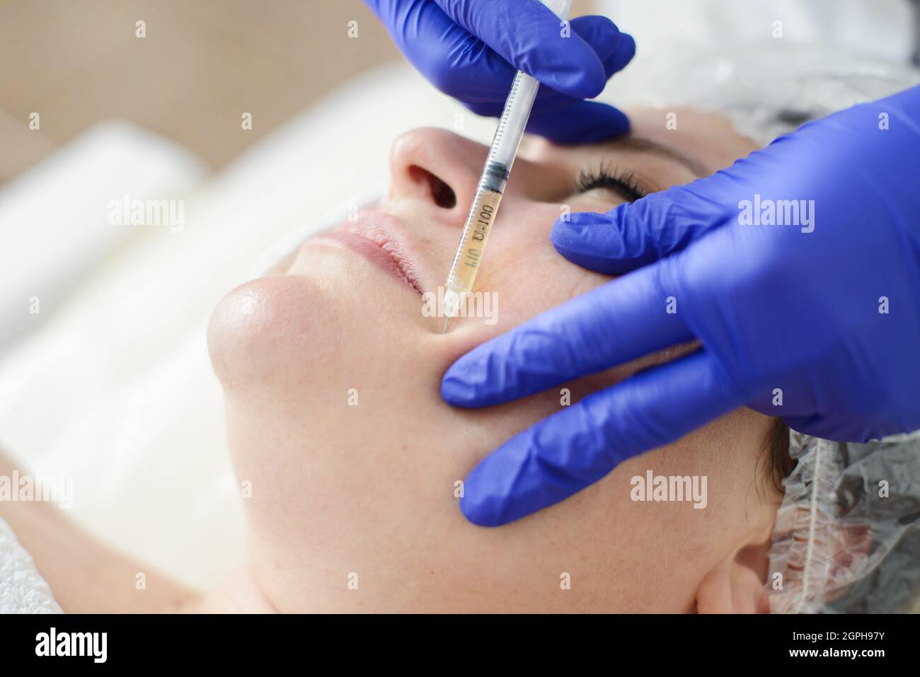 Needle mesotherapy in beauty spa salon or clinic. Cosmetics been ...
