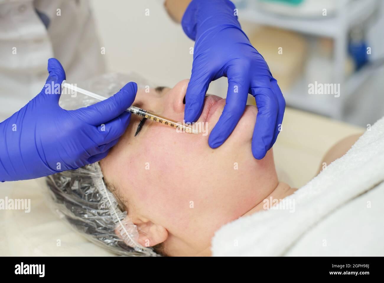 Needle mesotherapy in beauty spa salon or clinic. Cosmetics been ...